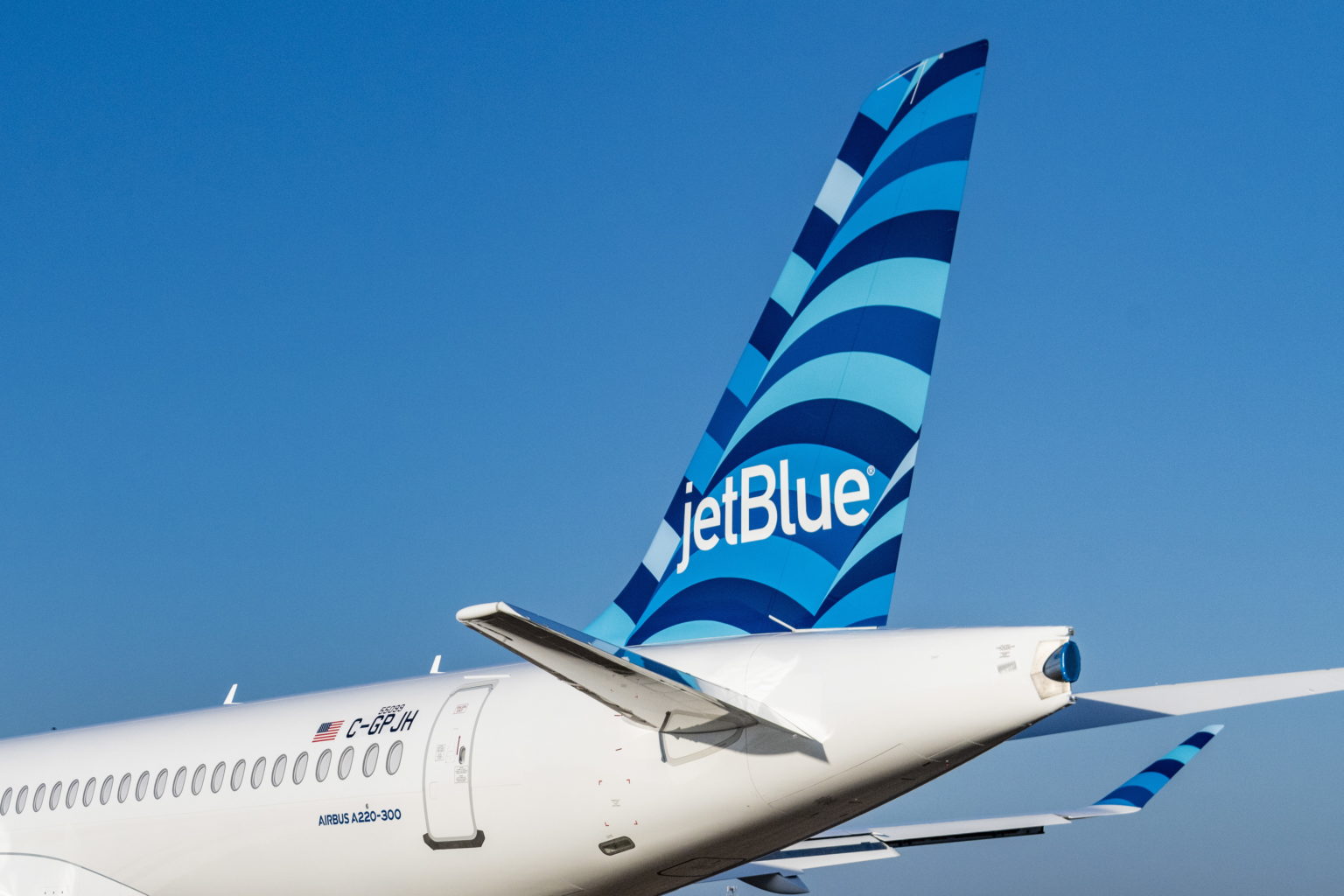 JetBlue's first A220 emerges with a new tail design | PaxEx.Aero